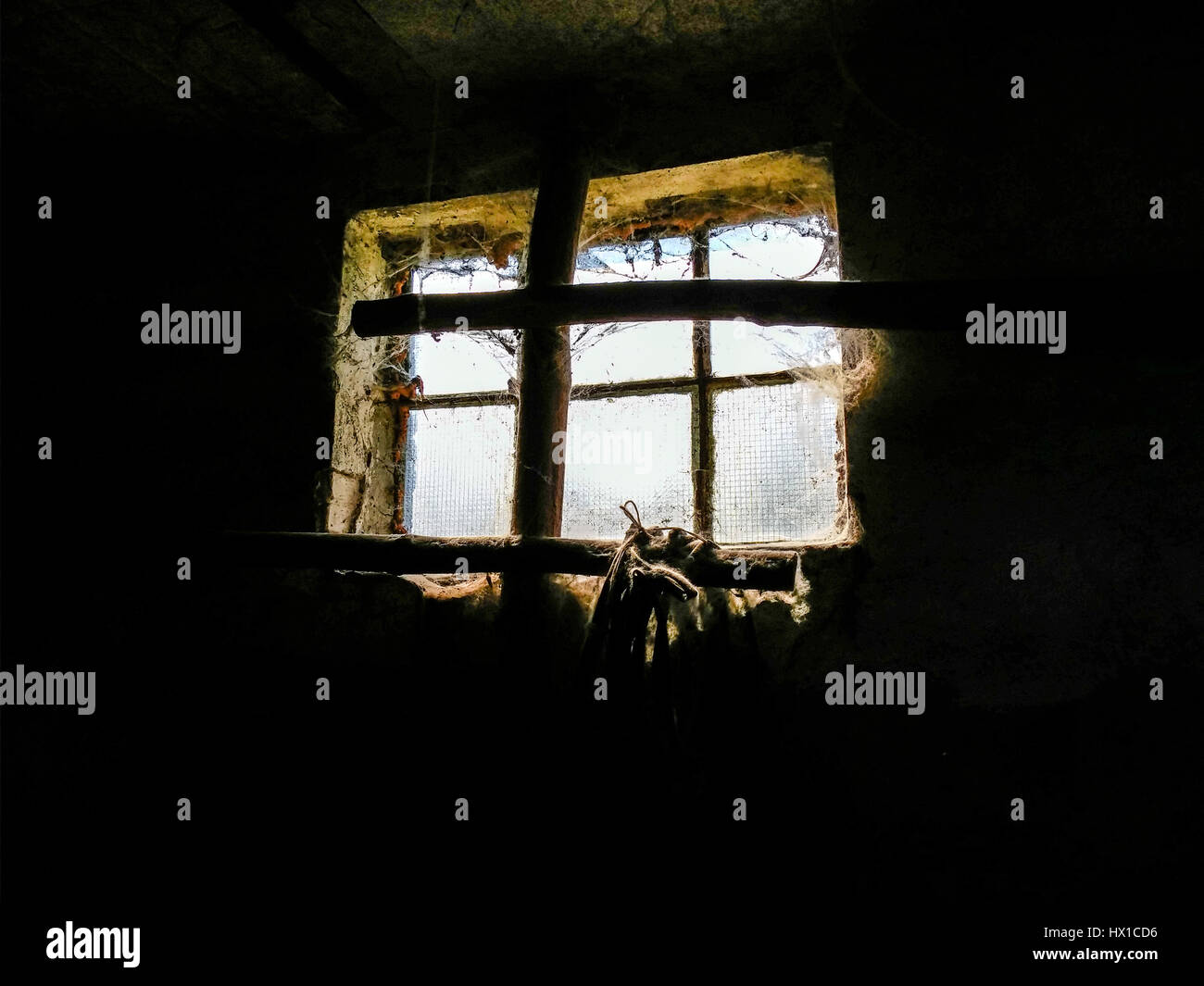 Single window in the dark abandoned building Stock Photo - Alamy