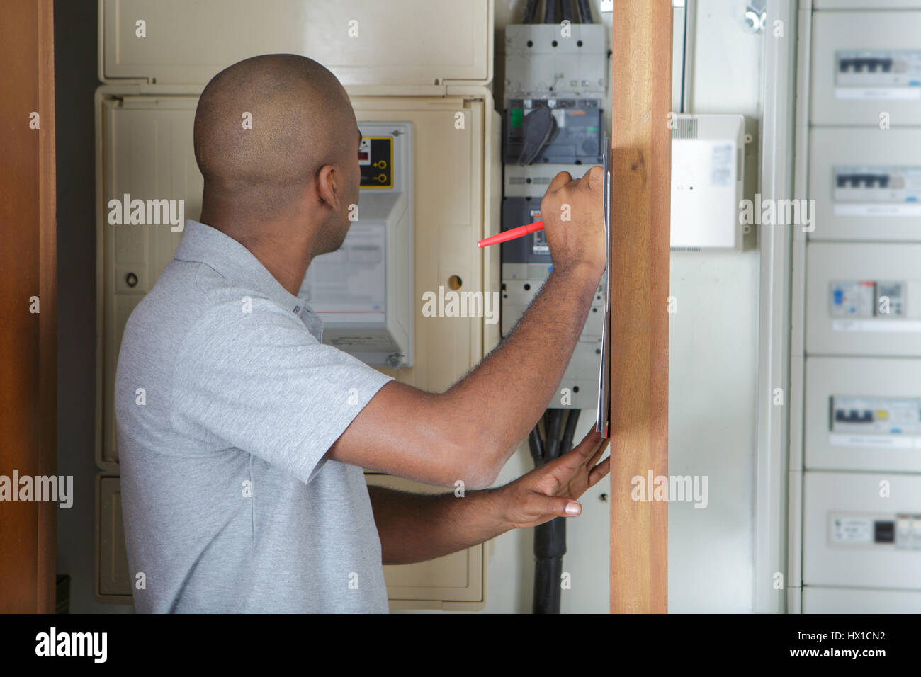 lineman checking the panel Stock Photo - Alamy
