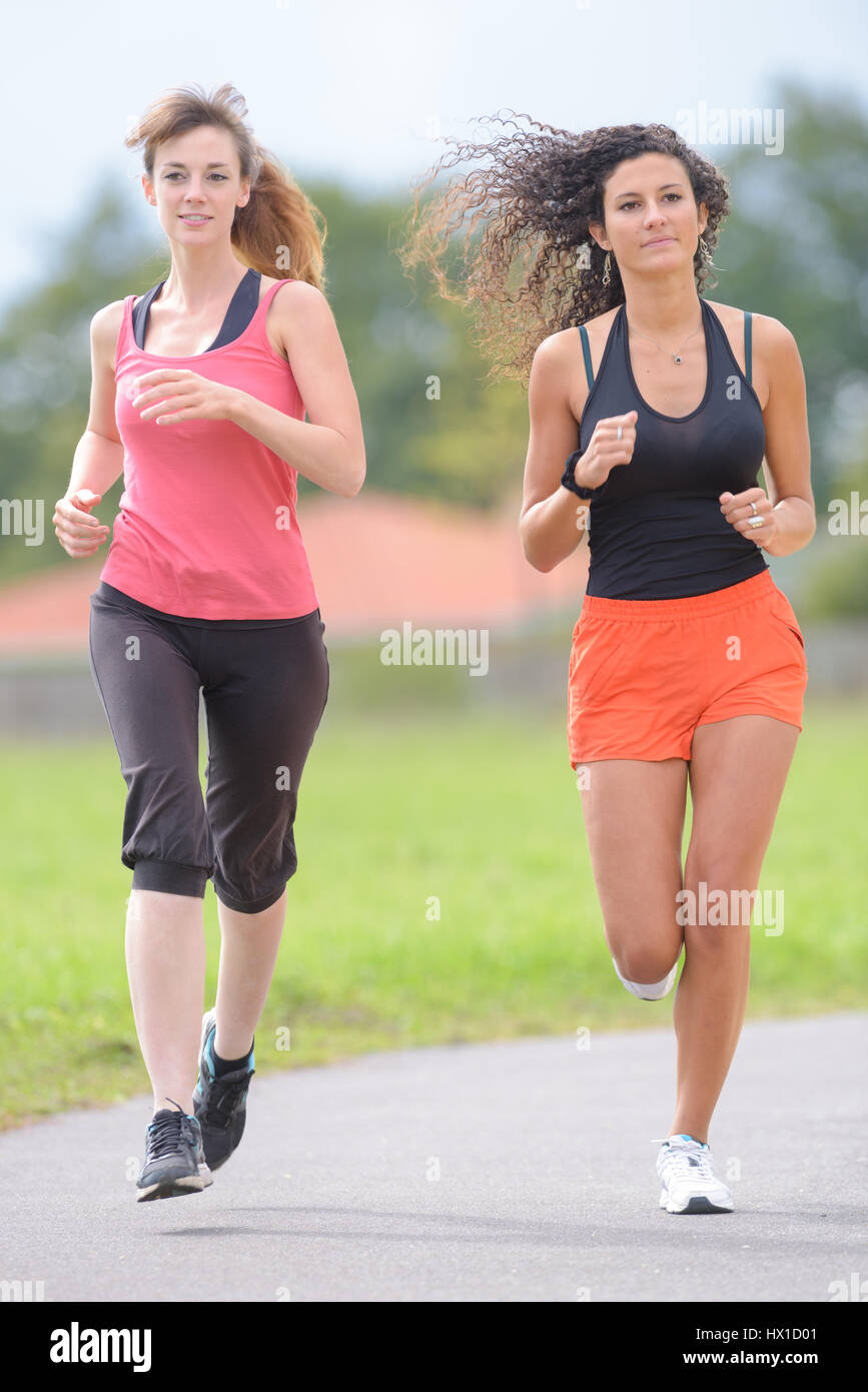 two women jogging Stock Photo - Alamy