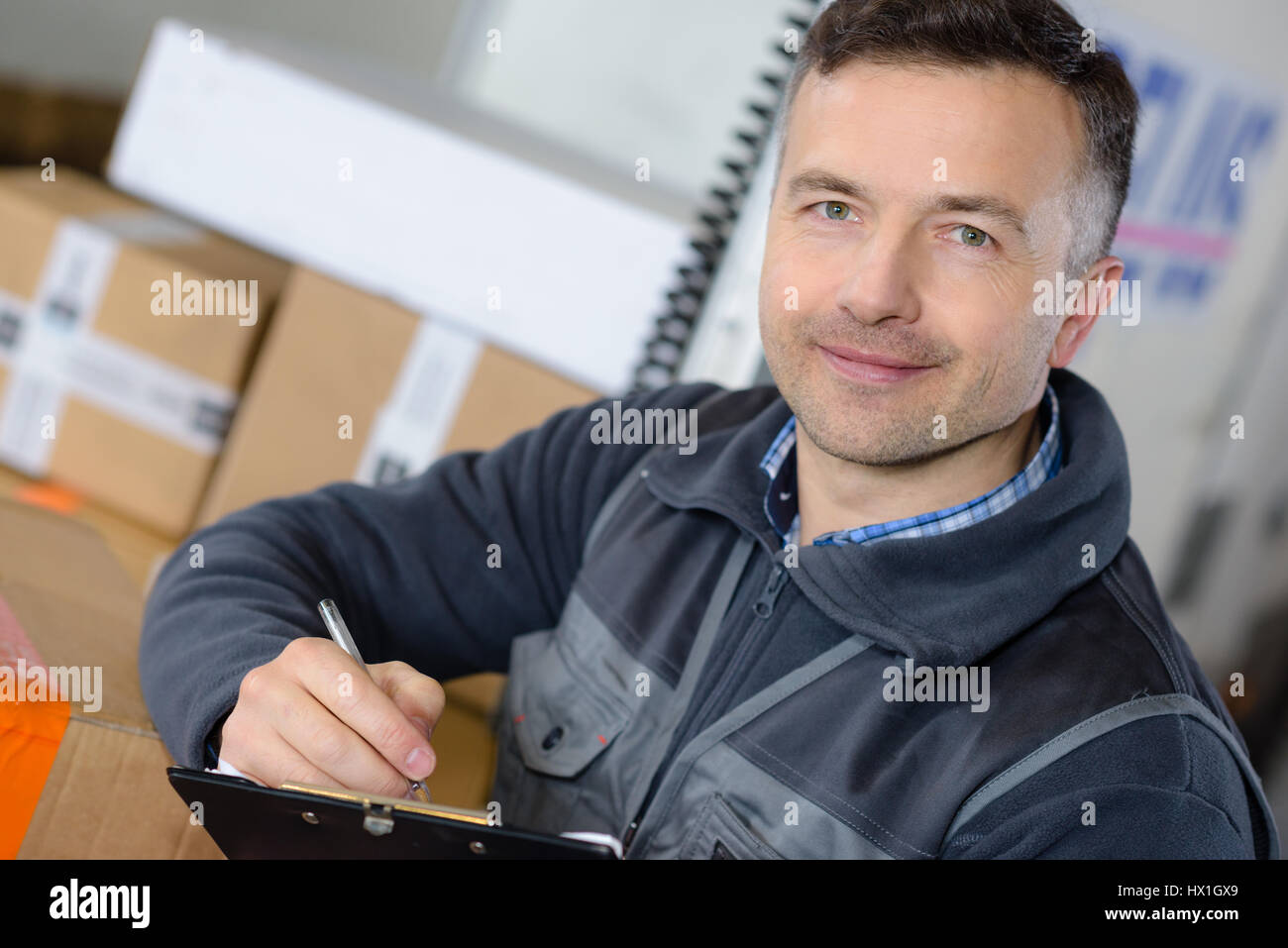 delivery man with parcel near cargo truck shipping service Stock Photo ...