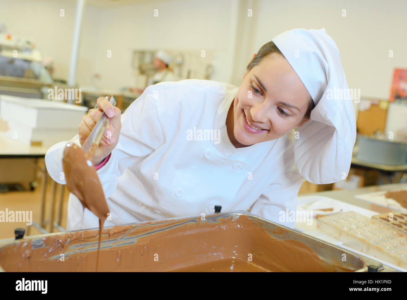 scooping melted chocolate Stock Photo - Alamy