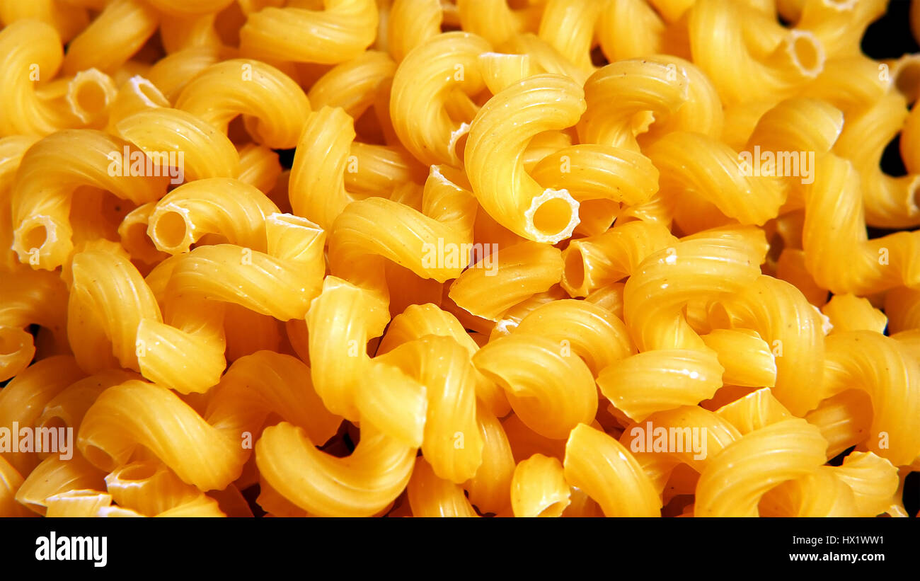 Pasta serpentine. Dry raw Italian pasta Stock Photo - Alamy