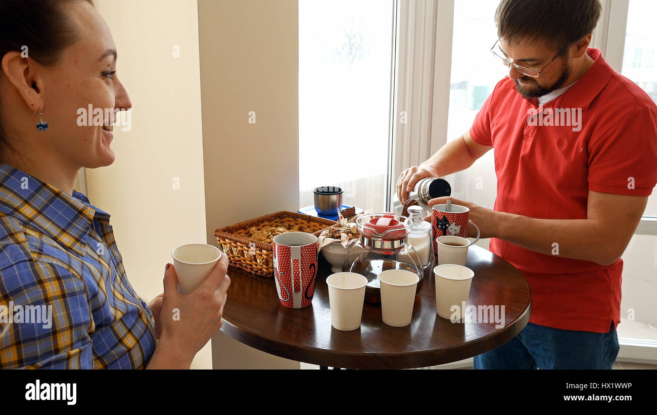 Girl laughing drinking tea hi-res stock photography and images - Alamy
