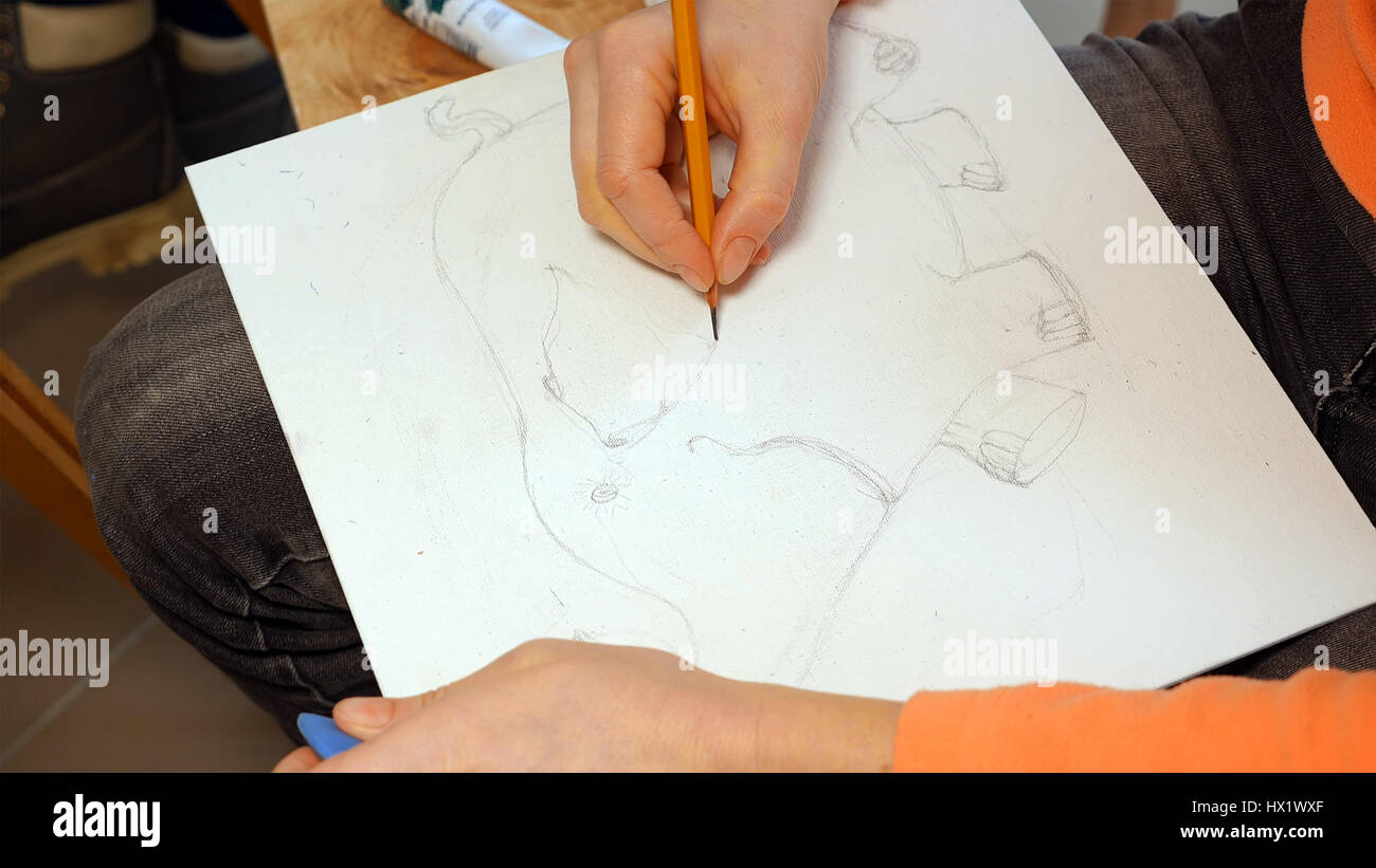 Female artist draws a pencil sketch in art studio Stock Photo - Alamy