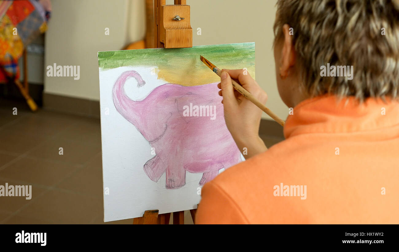 Female artist draws a pencil sketch in art studio Stock Photo - Alamy