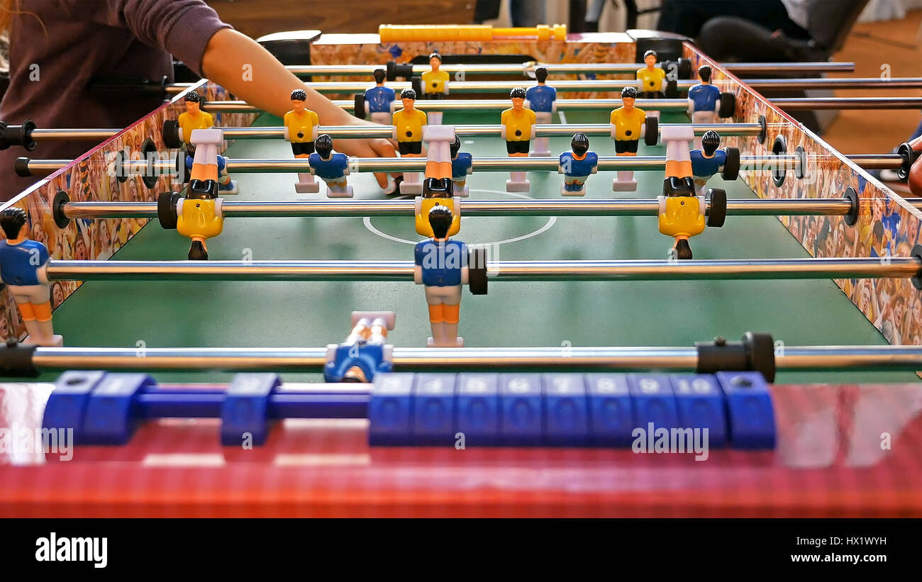 Father and child play kicker table football soccer Stock Photo - Alamy