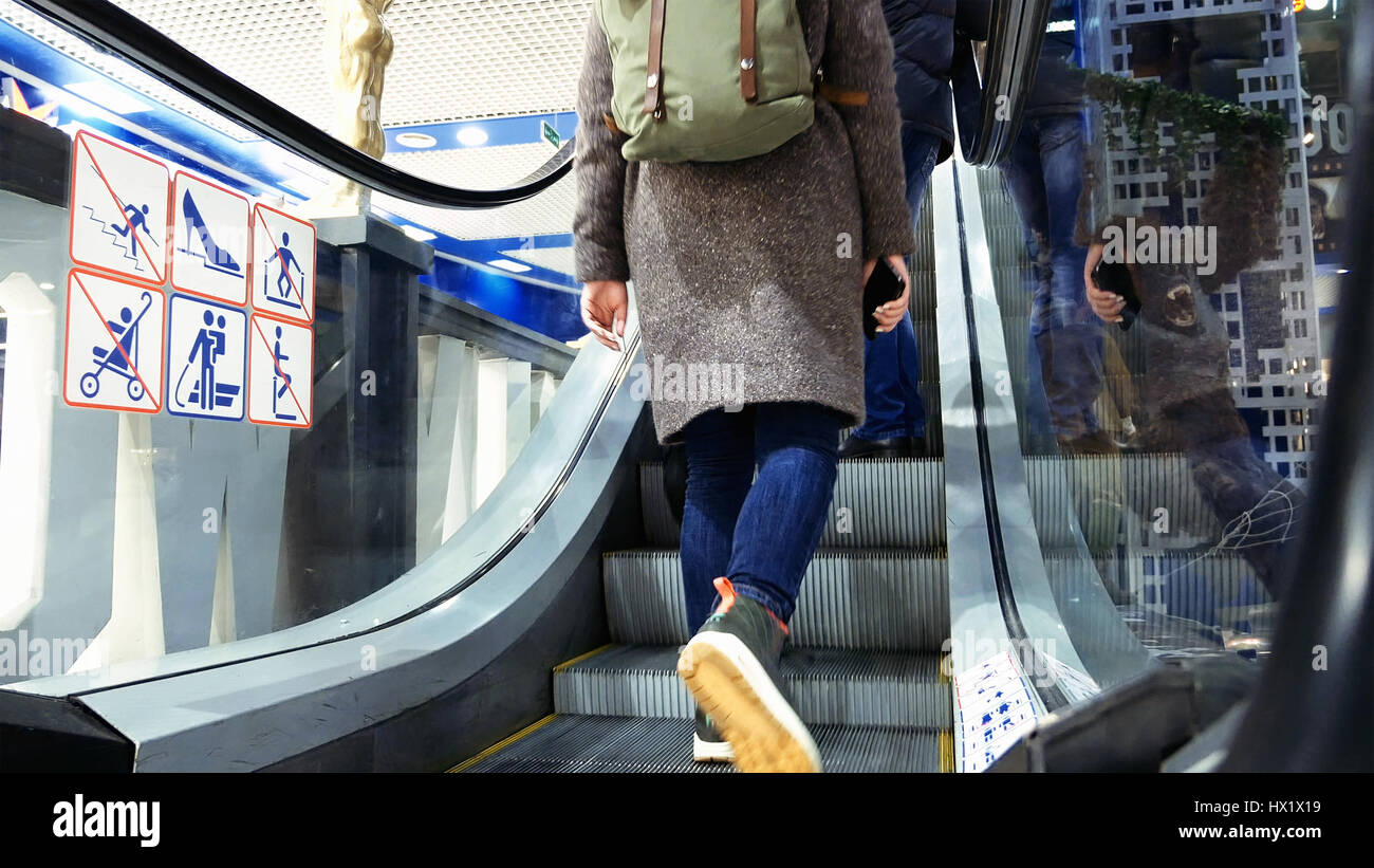 People moving up on escalators at shopping center Stock Photo - Alamy