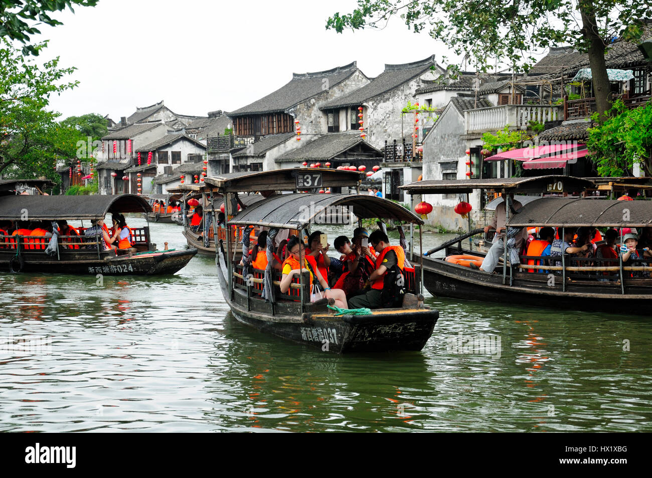 August 8, 2015. Xitang Water Town, China. Crowded tourist boats on the ...