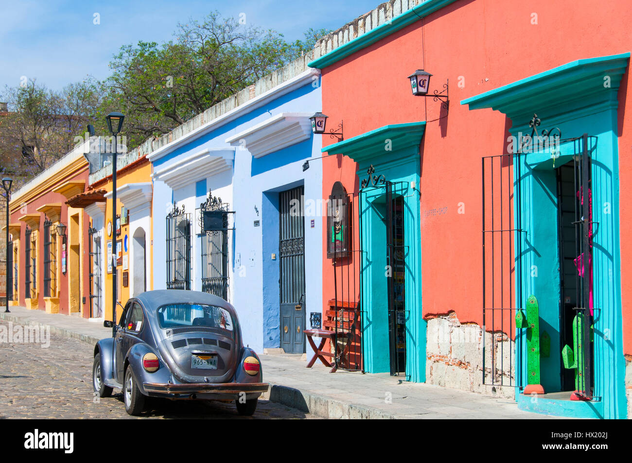 Street with colonial houses in the historic city center of Oaxaca ...