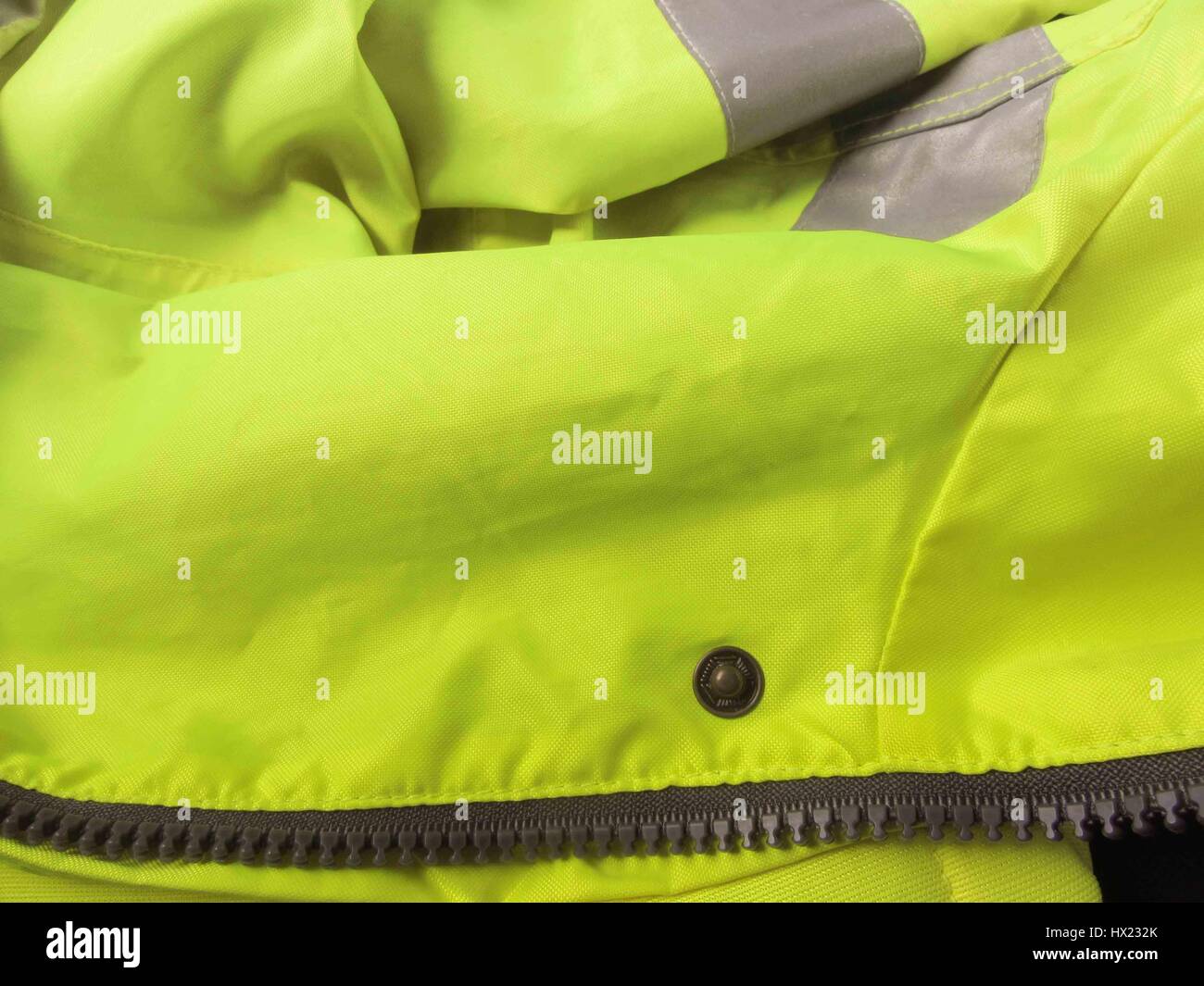 high visibility yellow jacket as background Stock Photo - Alamy