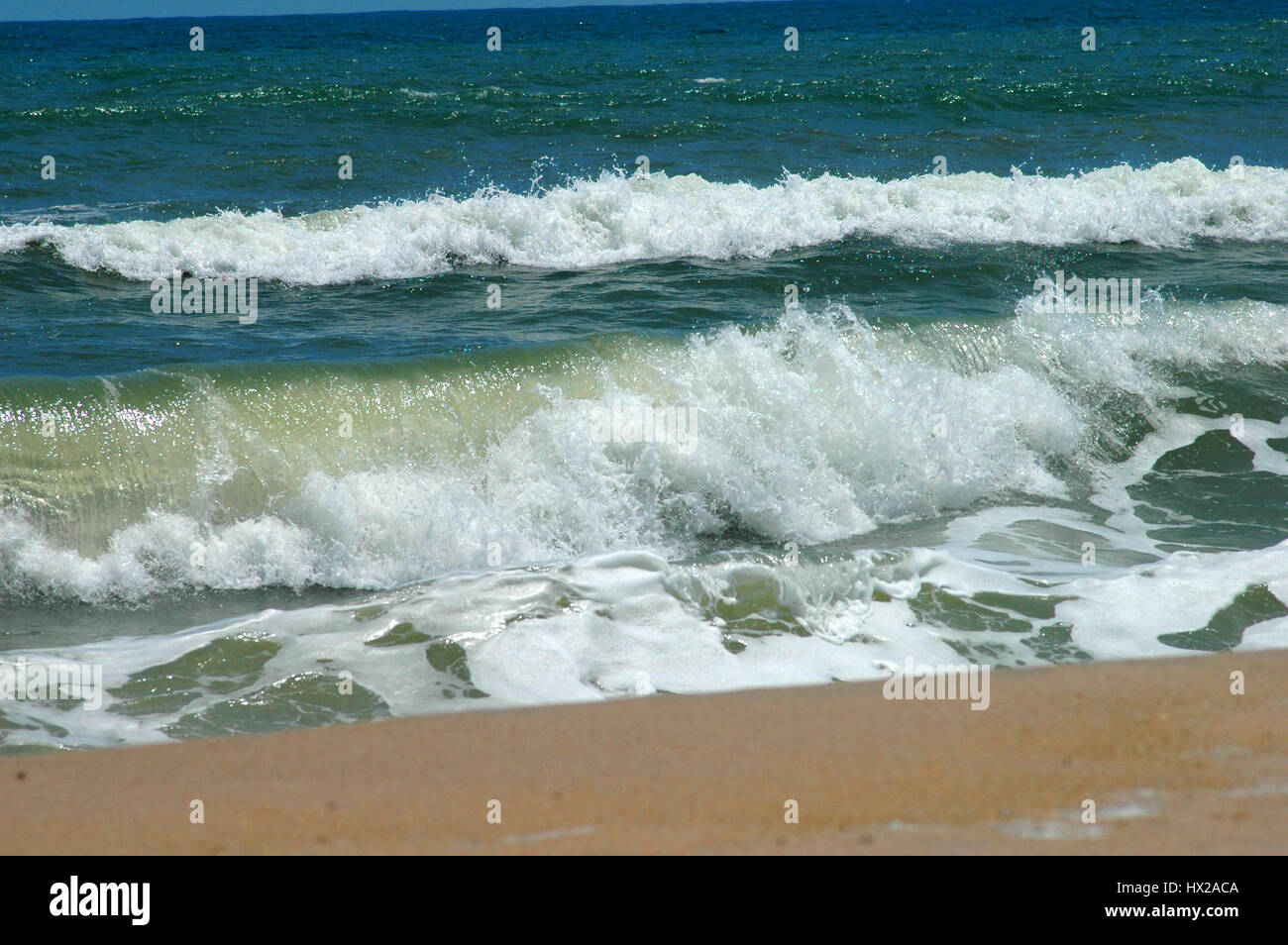 waves rolling on the beach Stock Photo - Alamy