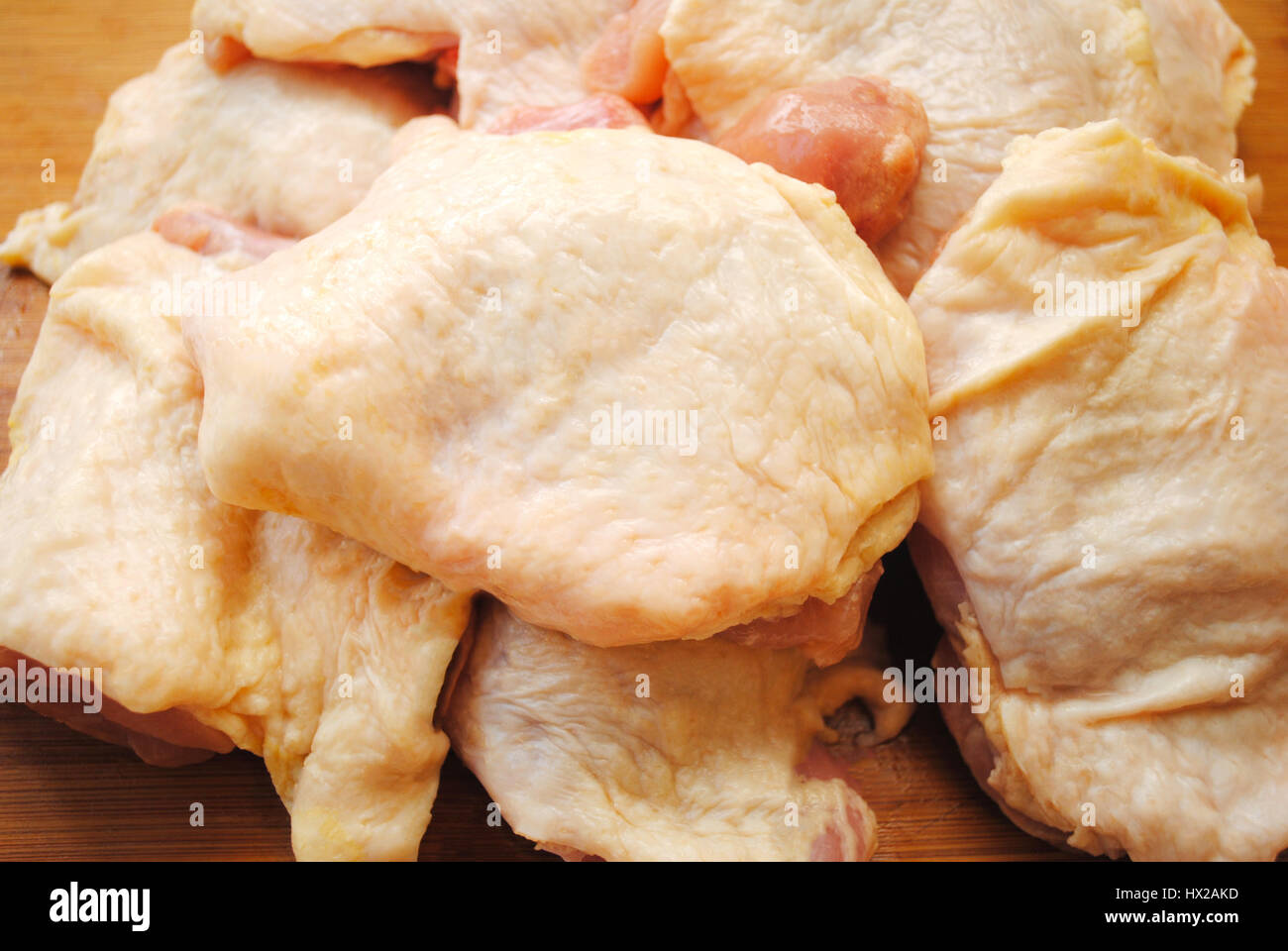 A Pile of Many Raw Chicken Thighs Stock Photo - Alamy