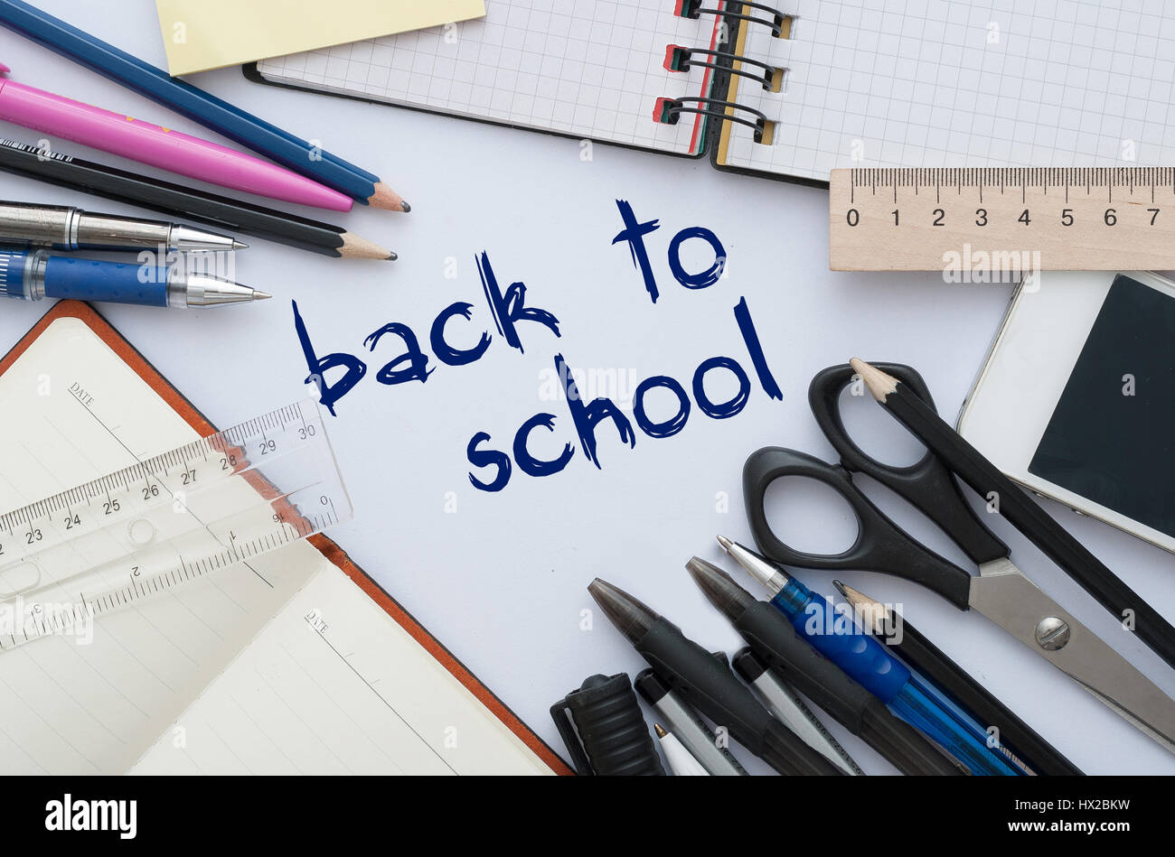 School set with back to school inscription in notebook and stationery ...