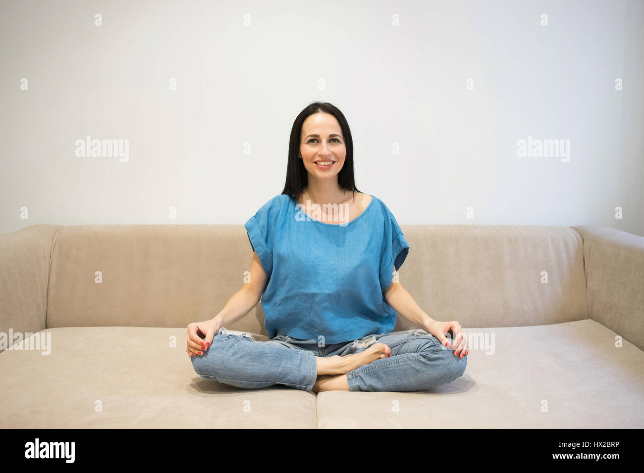 woman meditating in lotus position Stock Photo - Alamy