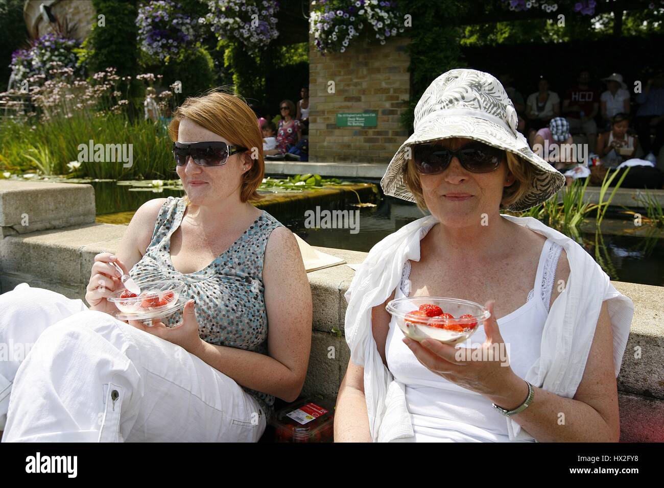 FANS EATING STRAWBERRIES WIMBLEDON 2010 WIMBLEDON 2010 WIMBLEDON LONDON ...