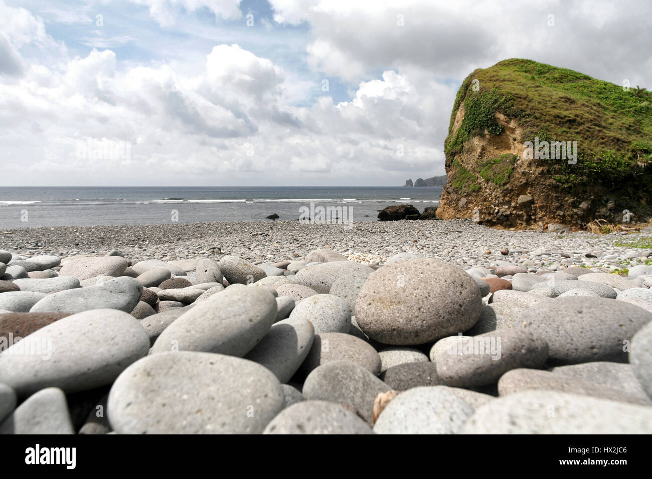 Endless stone and rock on the beach of Batanes Stock Photo - Alamy