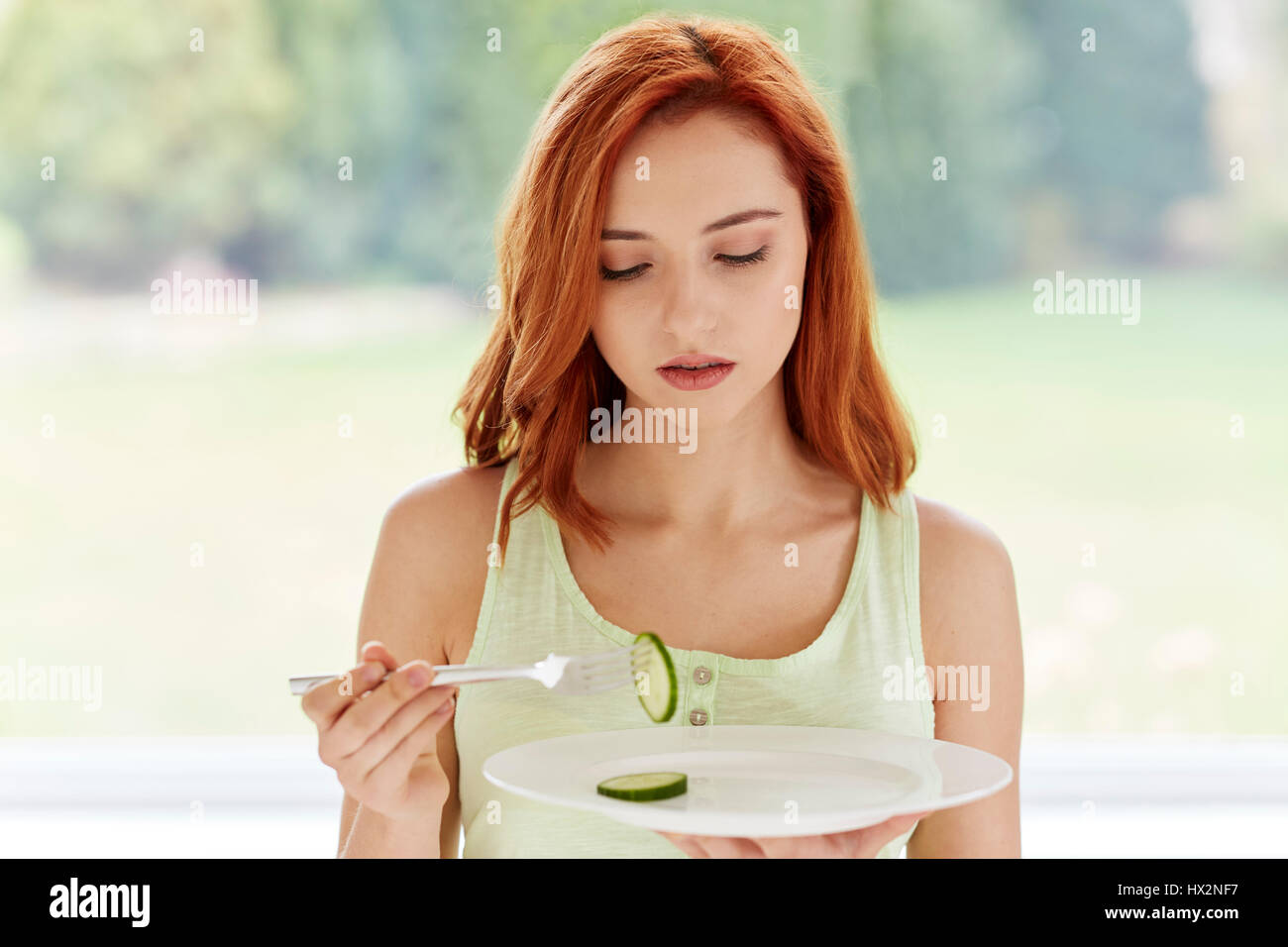 Girl with cucumber hi-res stock photography and images - Alamy