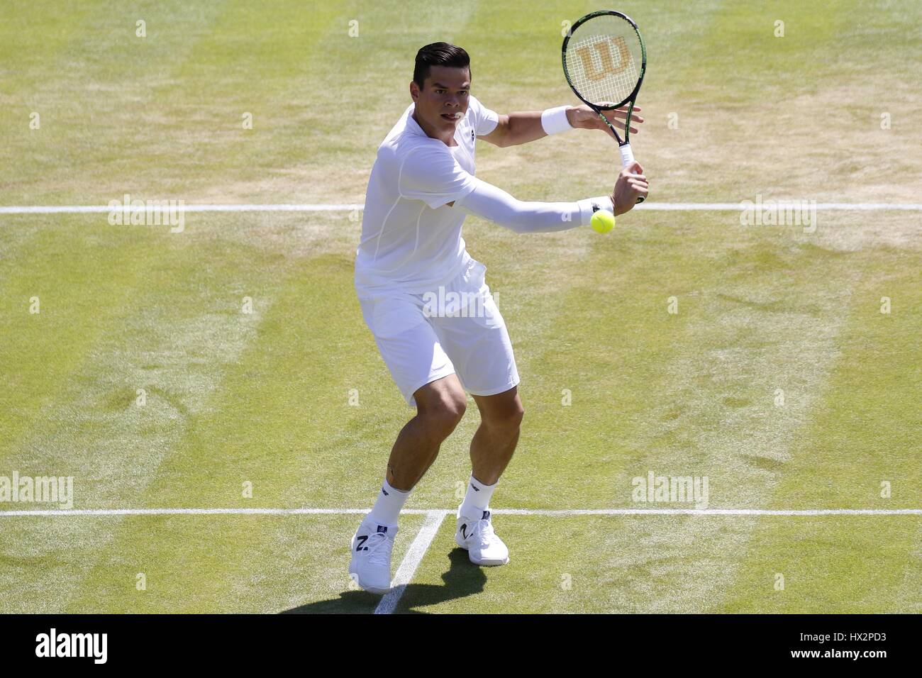Milos raonic in wimbledon tennis hi-res stock photography and images ...