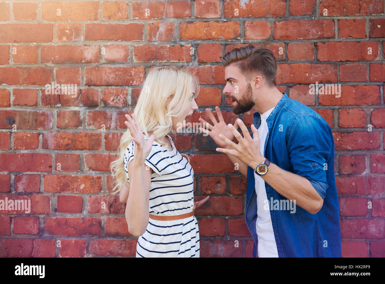 Young couple arguing very loudly Stock Photo - Alamy