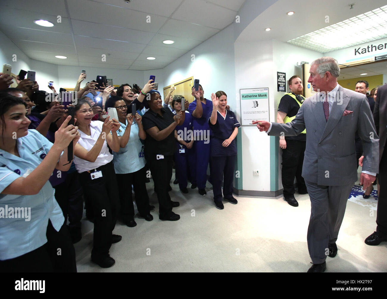 The Prince of Wales talks to nurses as he leaves after meeting ...