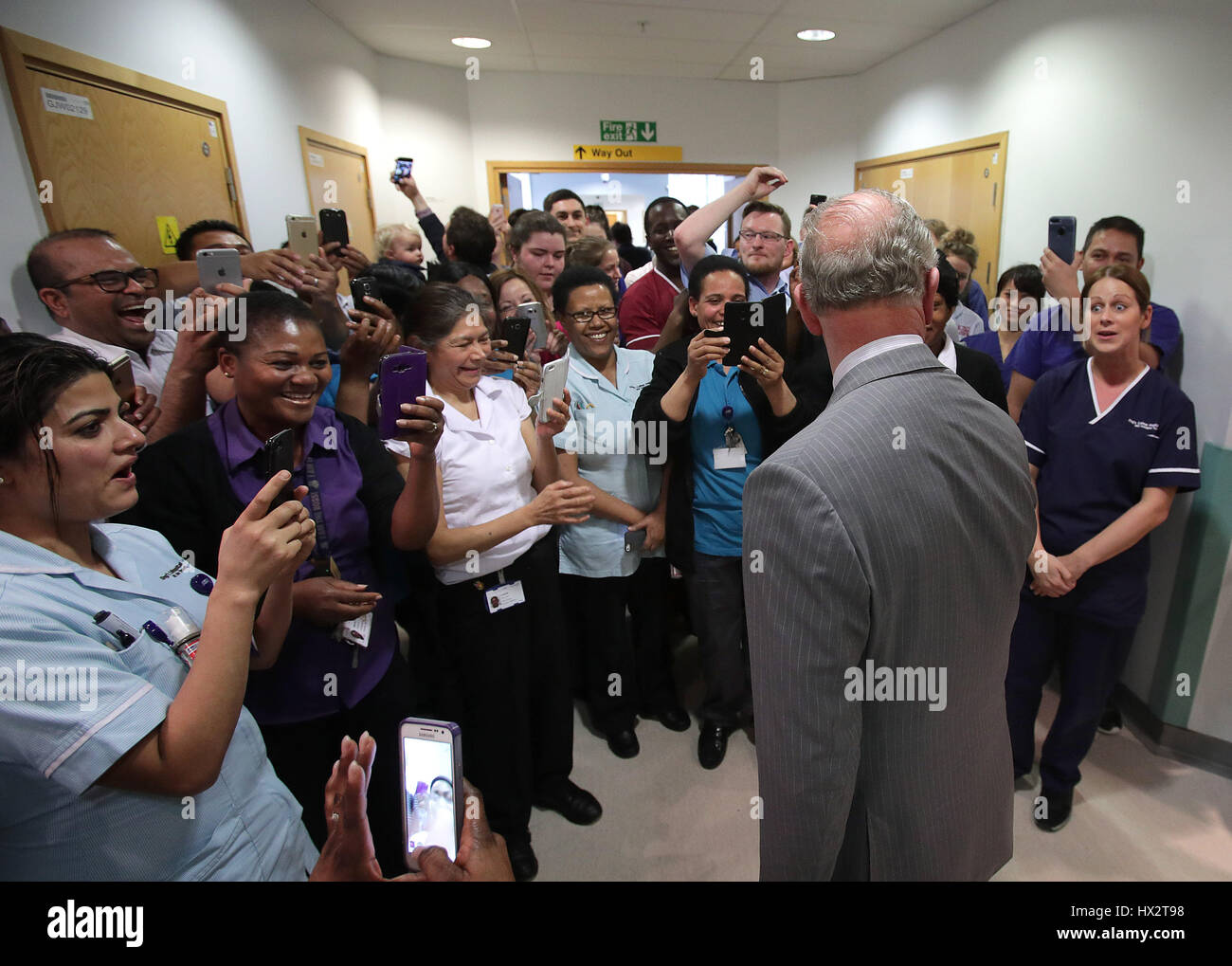 The Prince of Wales talks to nurses as he leaves after meeting ...