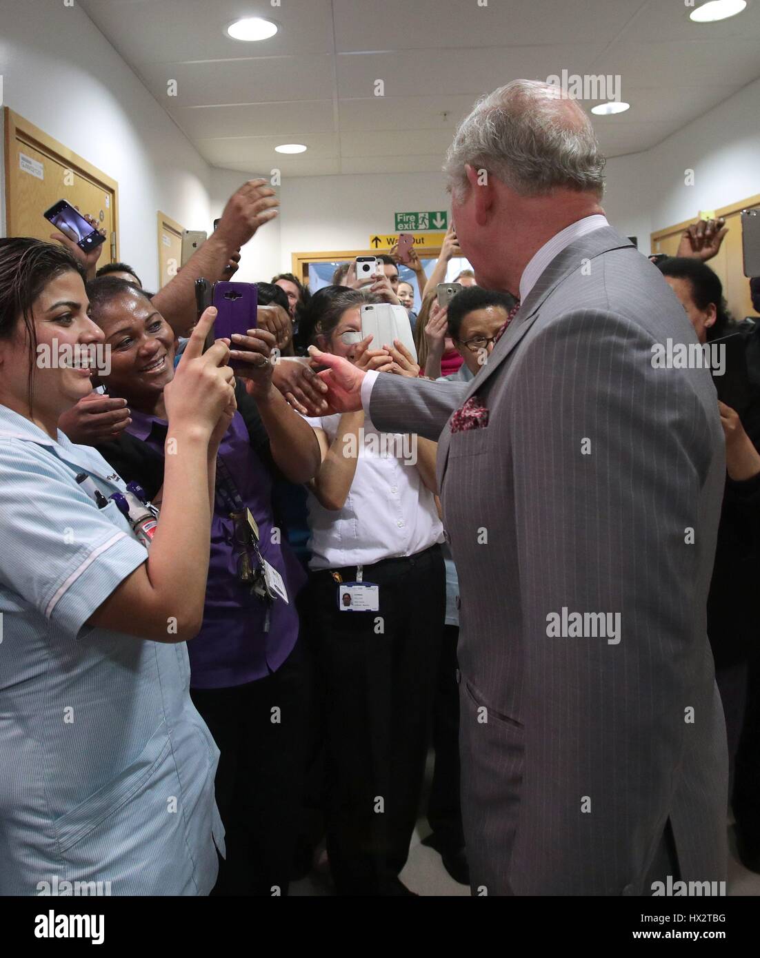 The Prince of Wales talks to nurses as he leaves after meeting ...