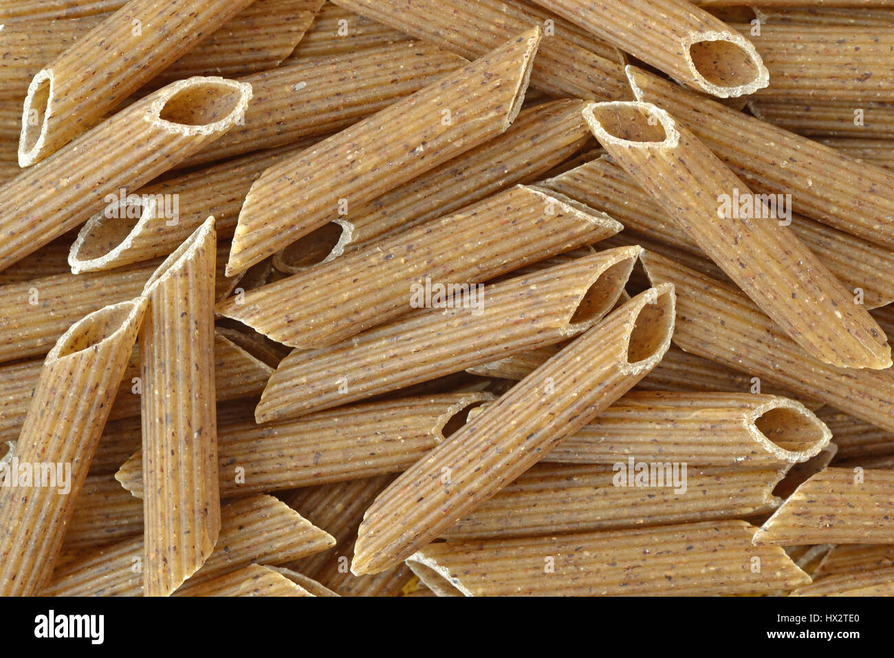 Texture background of raw buckwheat italian pasta Stock Photo - Alamy