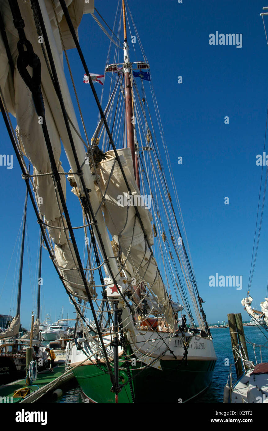 long front mast of a big sailboat docked Stock Photo - Alamy
