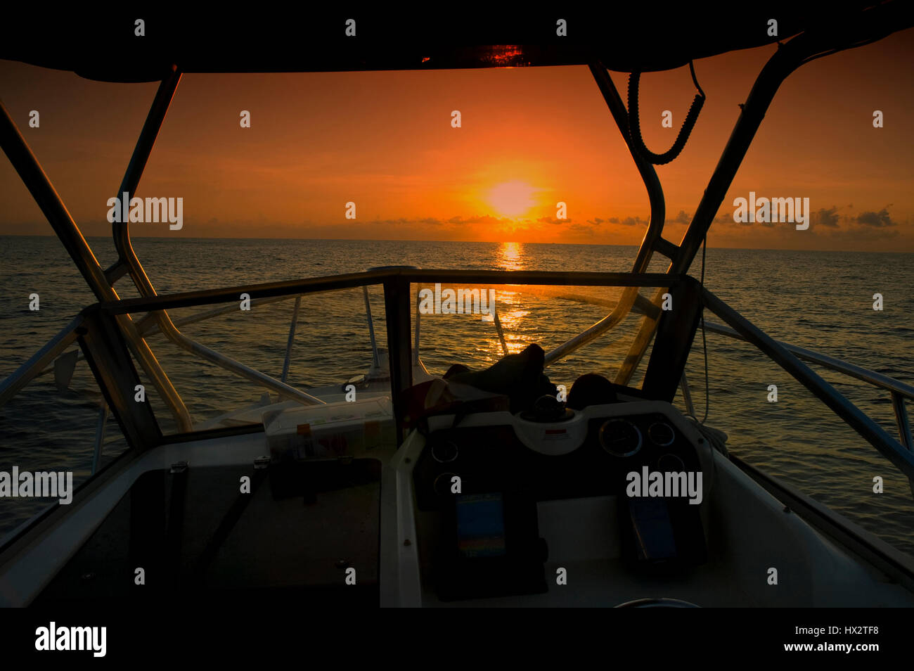 sunrise from bow of boat Stock Photo - Alamy
