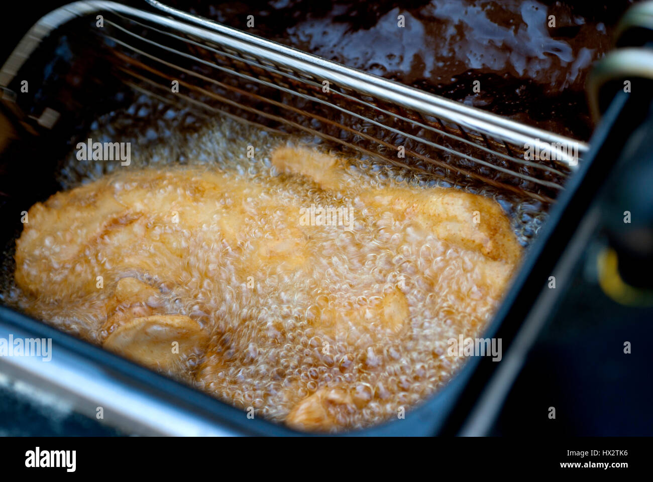 deep fried fish in fryer Stock Photo - Alamy