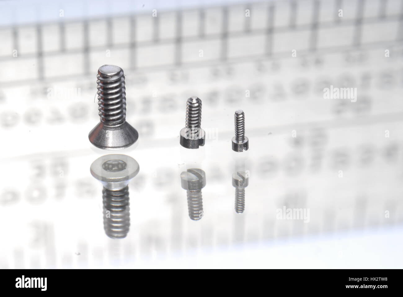 small screws with ruler Stock Photo - Alamy