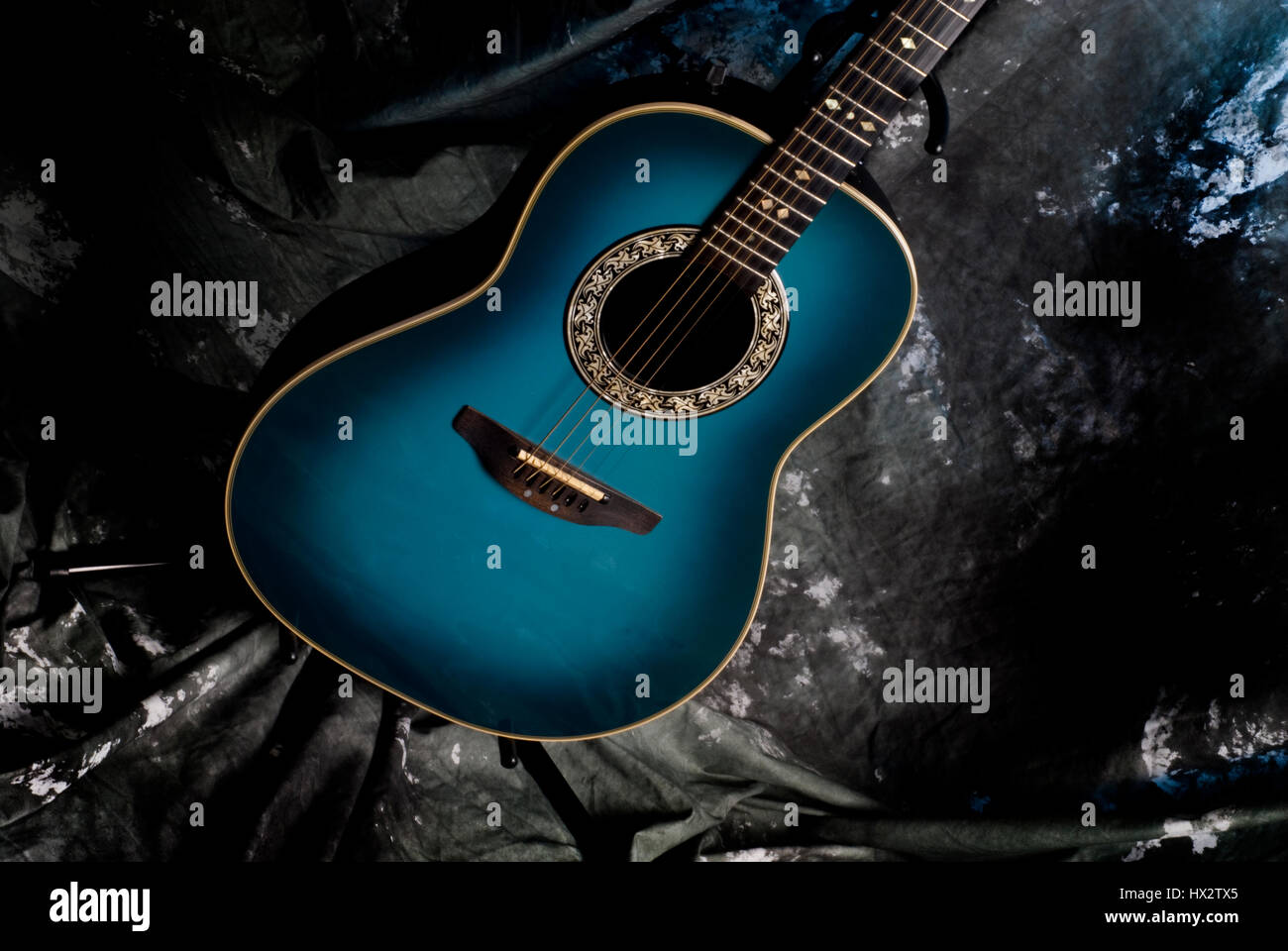 six string blue acoustic full guitar Stock Photo - Alamy
