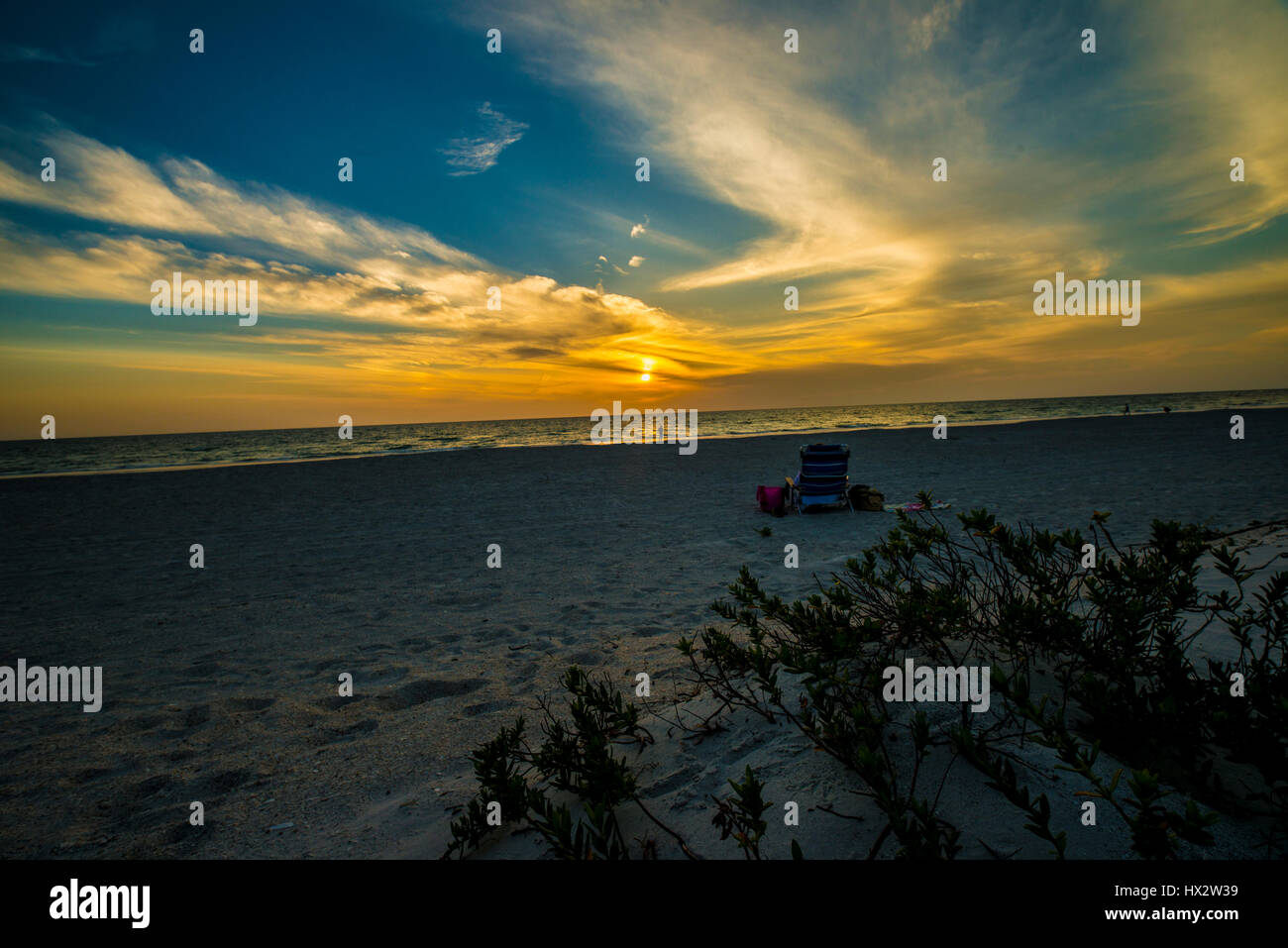 sunset at the beach Stock Photo - Alamy