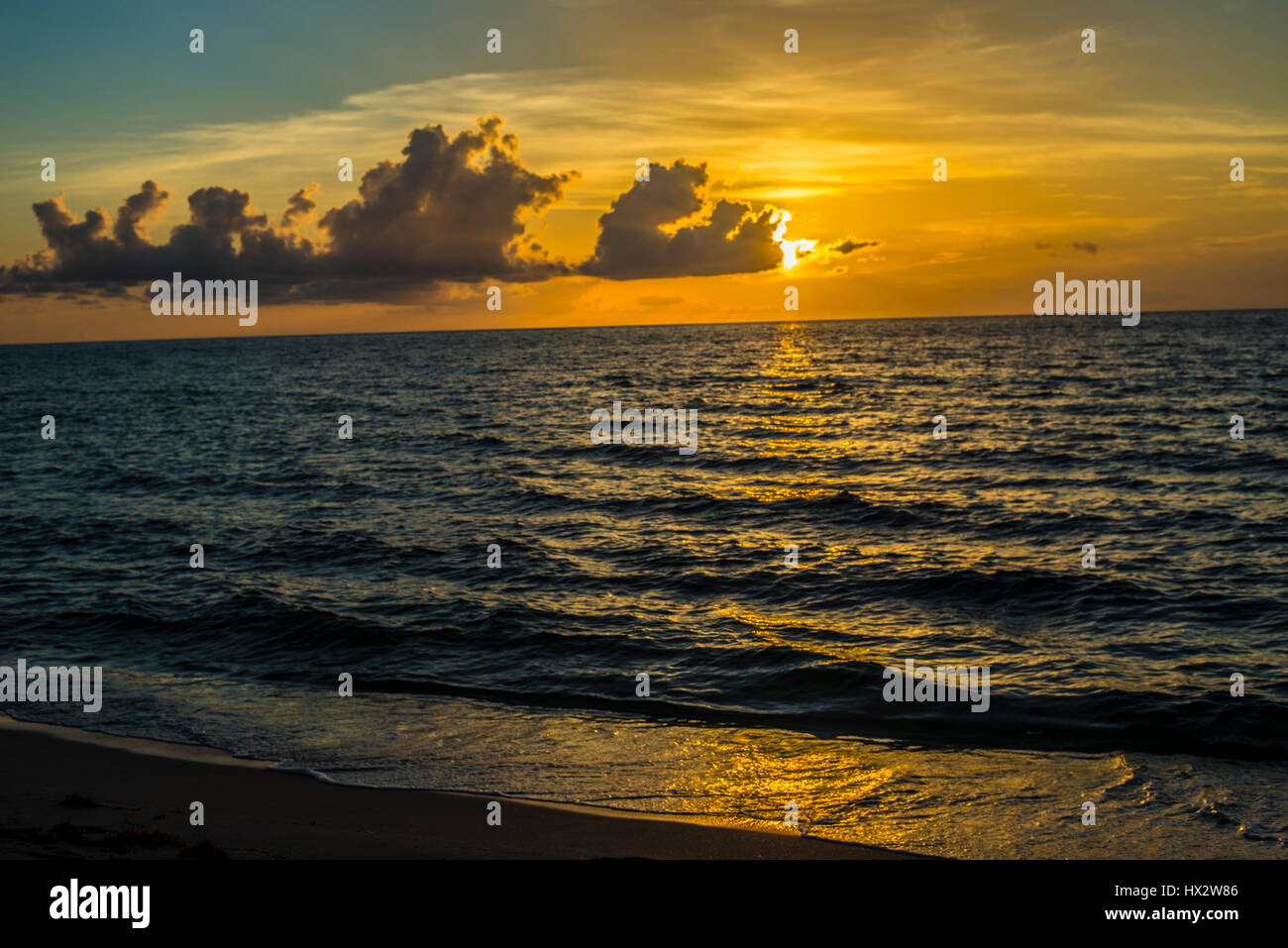 sunset at the beach Stock Photo - Alamy