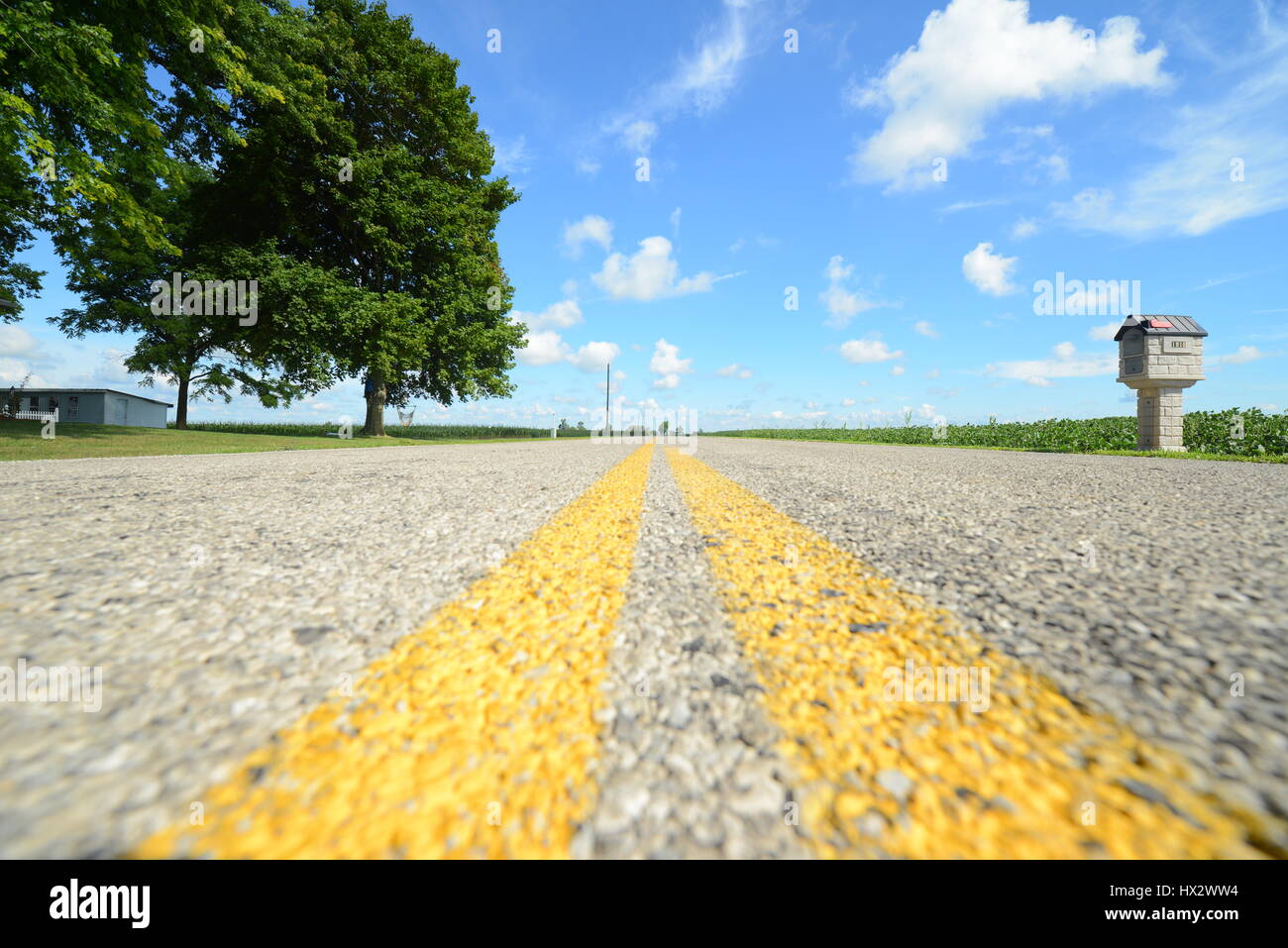 low angle country road double yellow line Stock Photo - Alamy