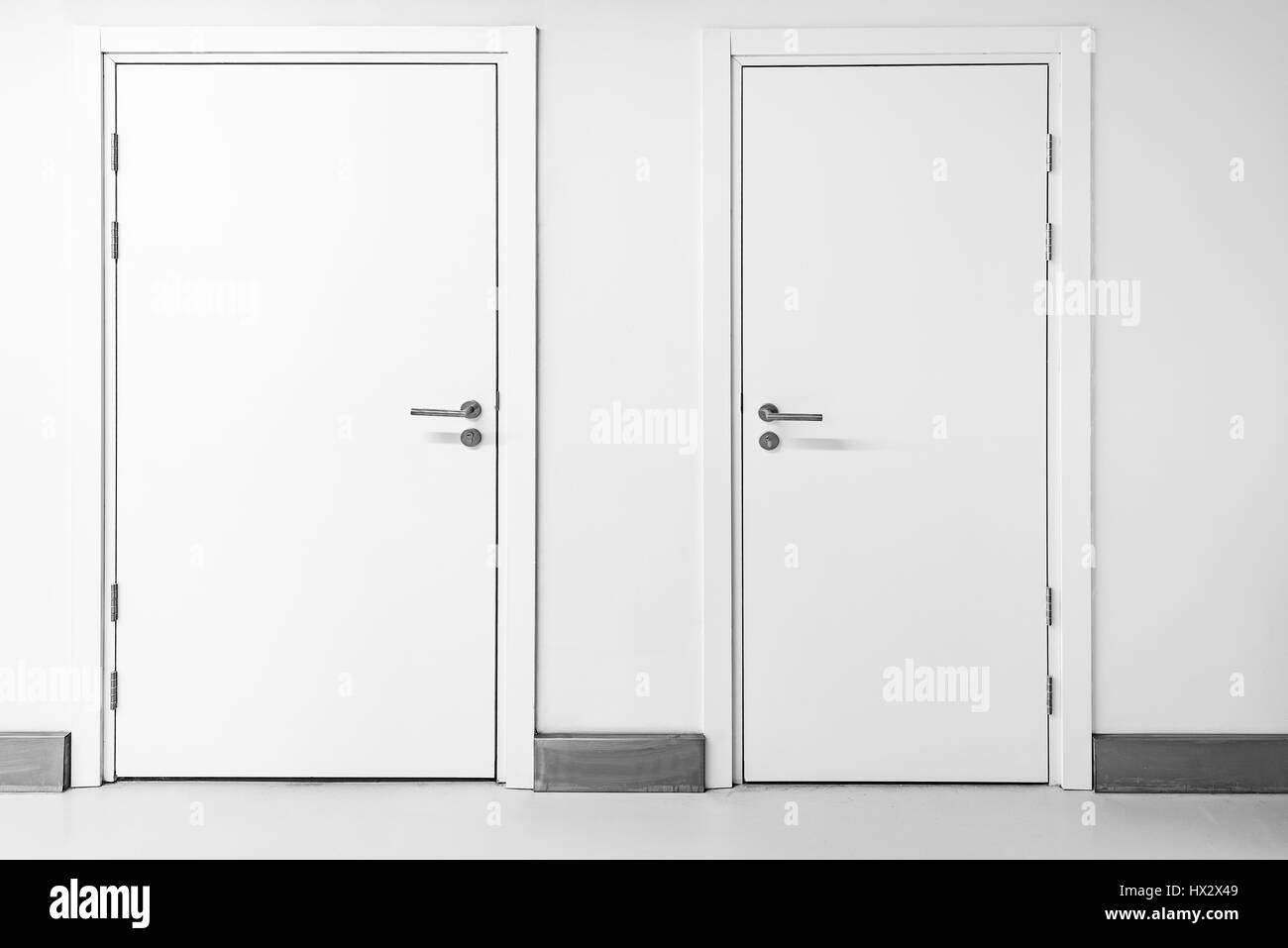 Two closed doors inside of the corridor Stock Photo - Alamy