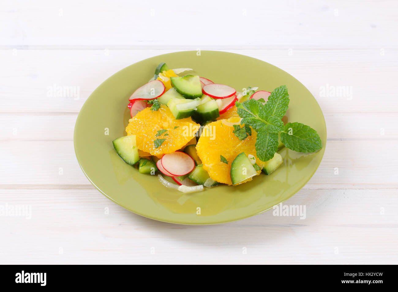 plate of radish salad with orange slices on white background Stock ...