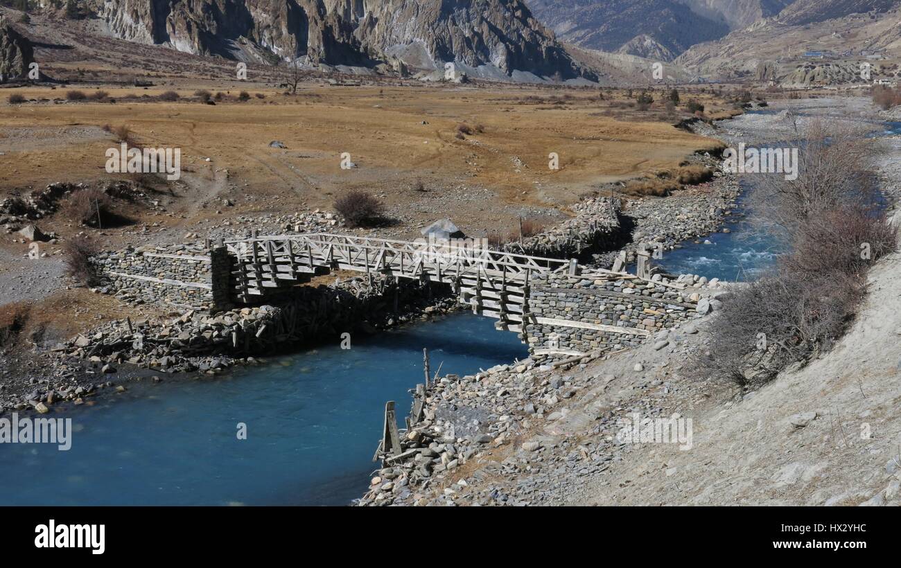Traditional timber bridge in Manang. Annapurna Conservation Area, Nepal ...