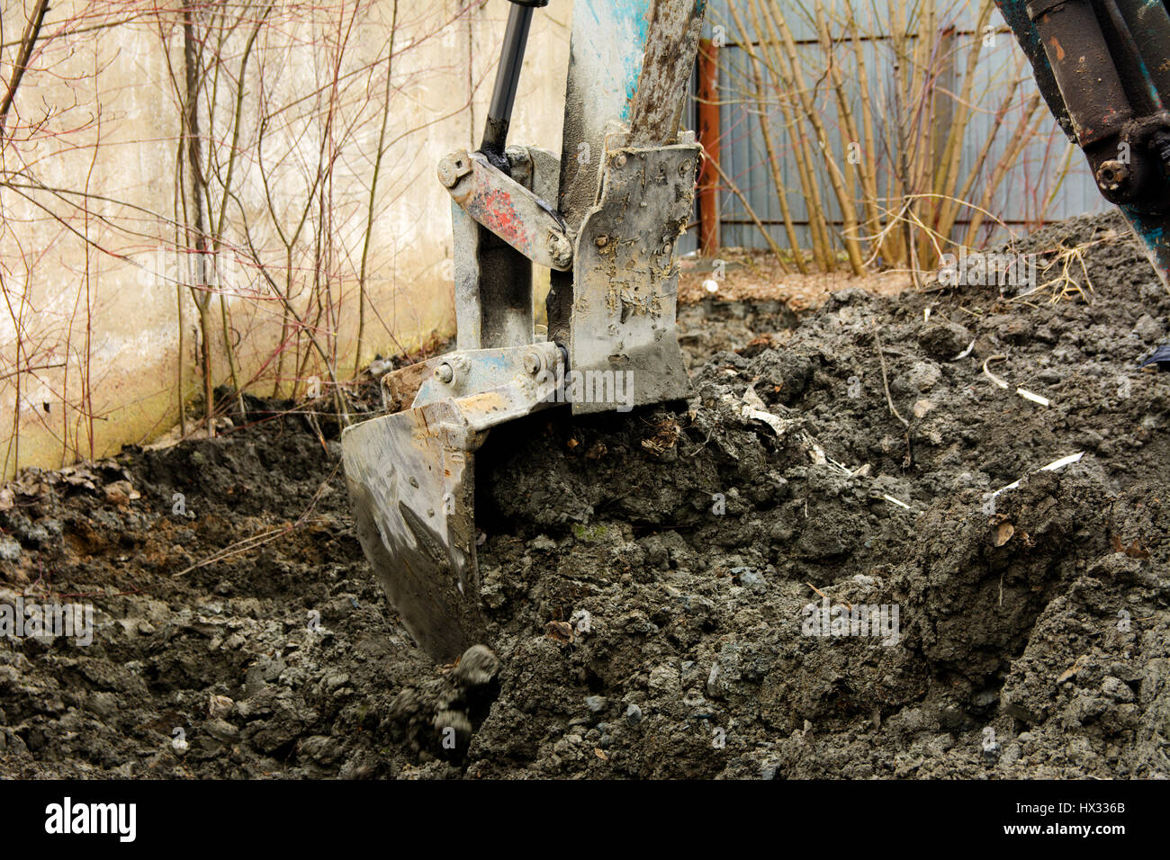 An old Soviet tractor digs and loads waste stone processing near the ...