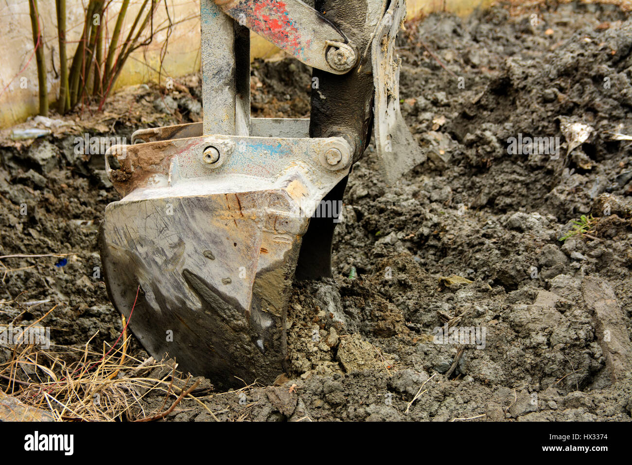 An old Soviet tractor digs and loads waste stone processing near the ...