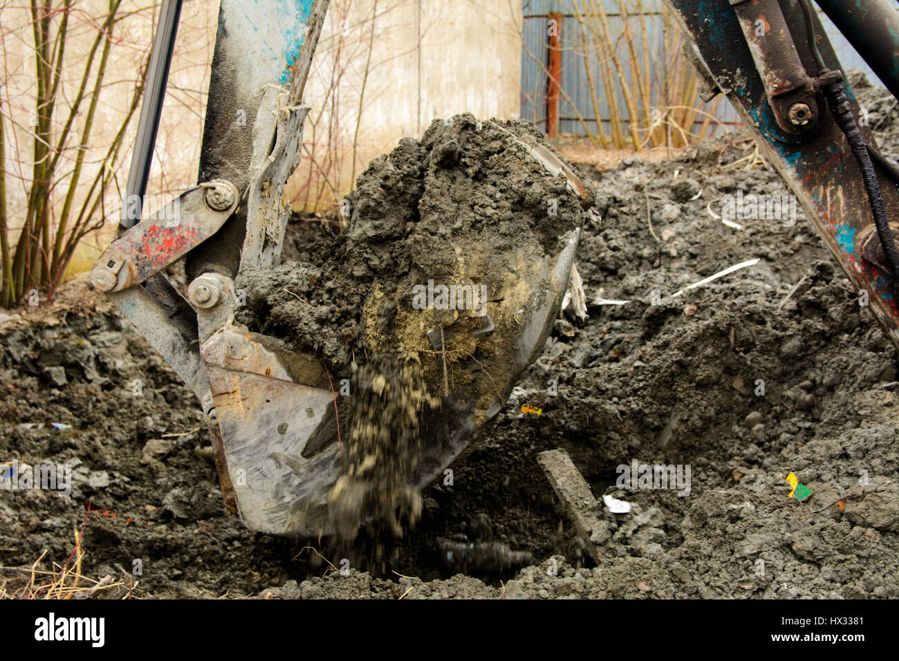 An old Soviet tractor digs and loads waste stone processing near the ...