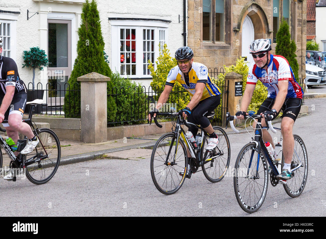 Cyclists in Stokesley, North Yorkshire, England, UK Stock Photo - Alamy