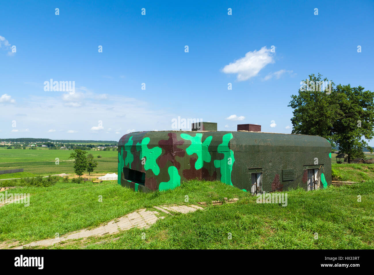 military fortification built of concrete and serves as a point of fire ...