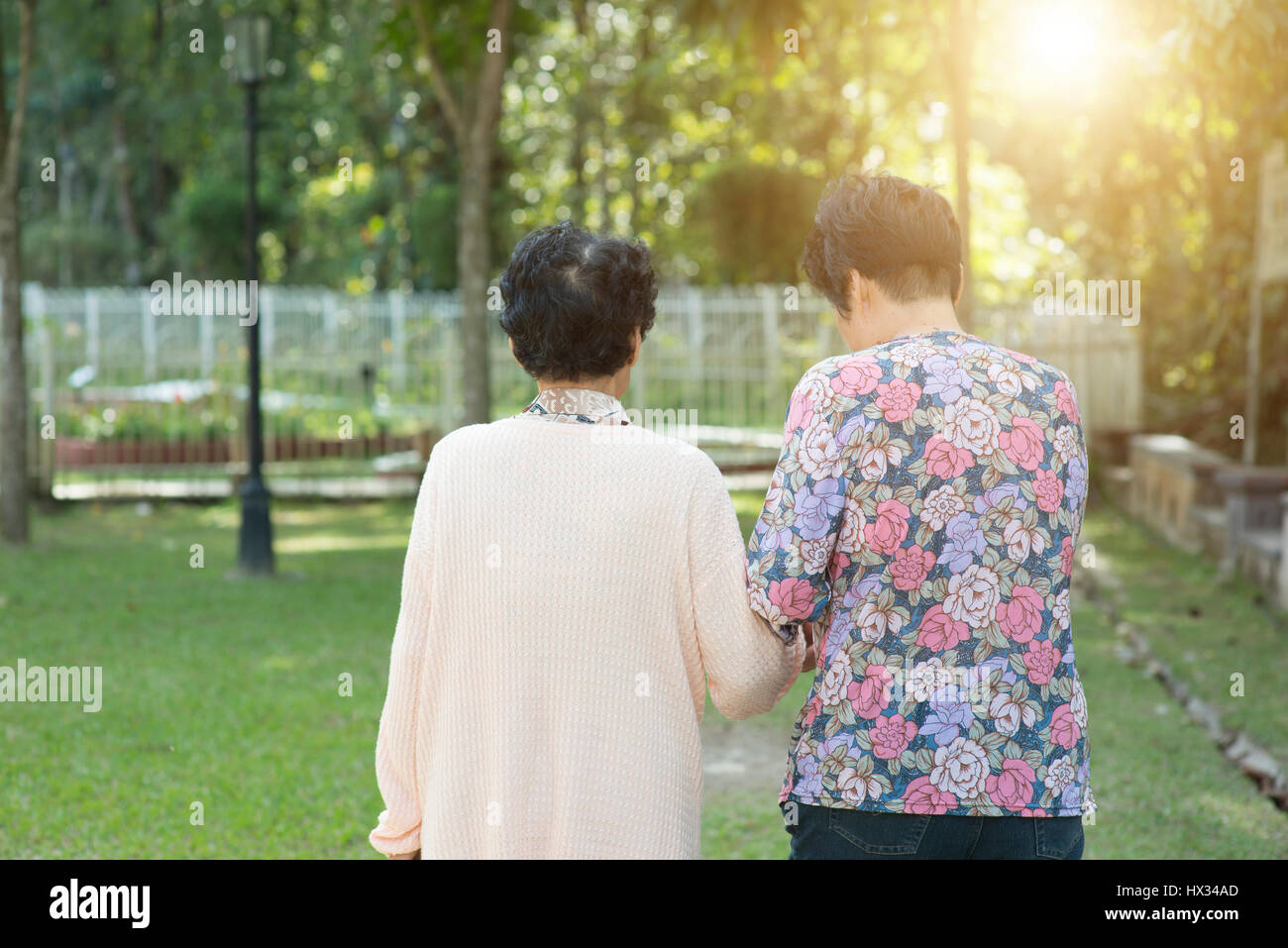 Back view two women outside walking hi-res stock photography and images ...