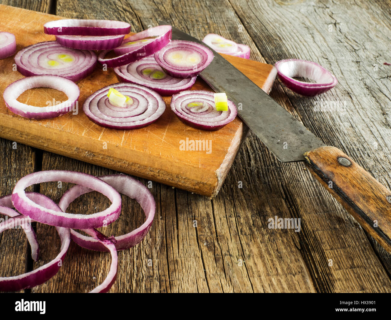 Sliced blue onion on an old weathered wooden table Stock Photo - Alamy