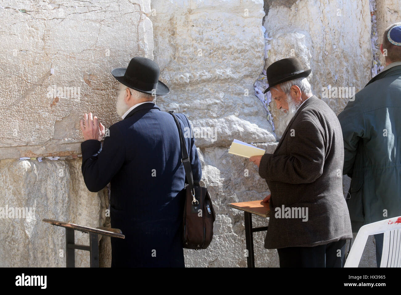 Jewish men pray at the western wall in Jerusalem, IL. The wall is one ...