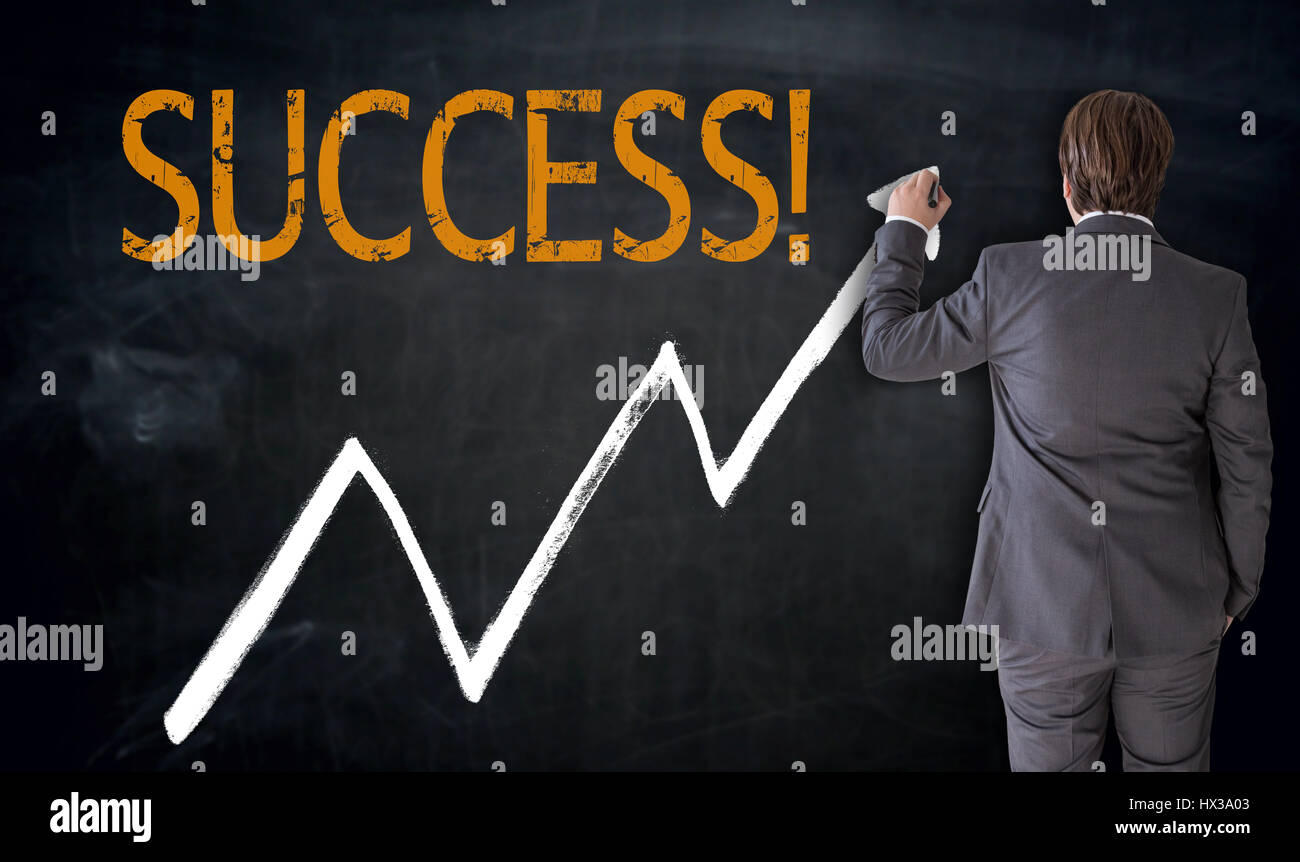 Businessman writes success on blackboard concept Stock Photo - Alamy