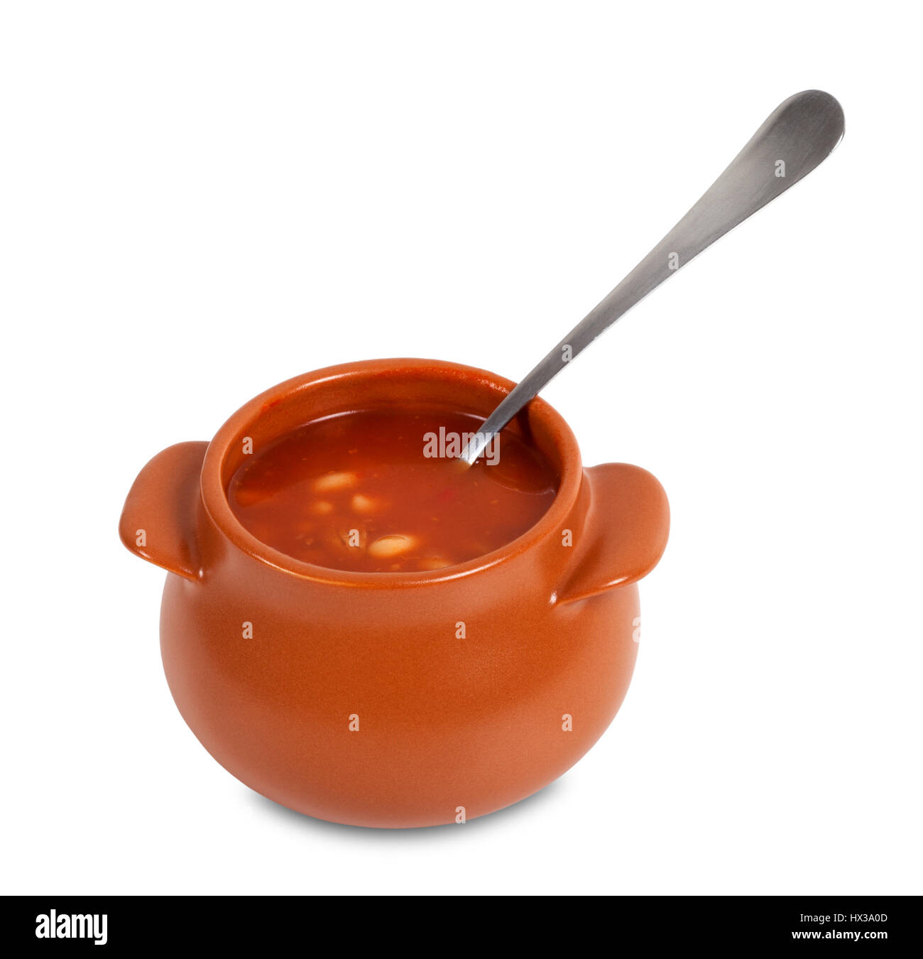 Soup in clay pot. Isolated on white background Stock Photo - Alamy