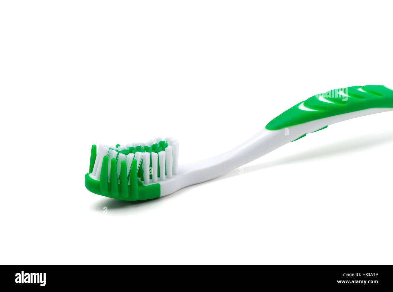 Green toothbrush isolated on white background Stock Photo - Alamy