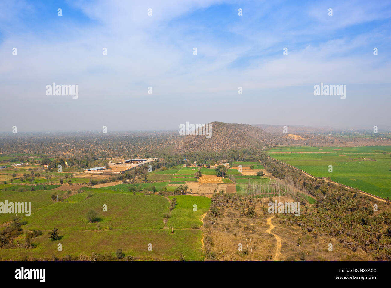 a view of farming landscape and hills from tijara fort palace in ...